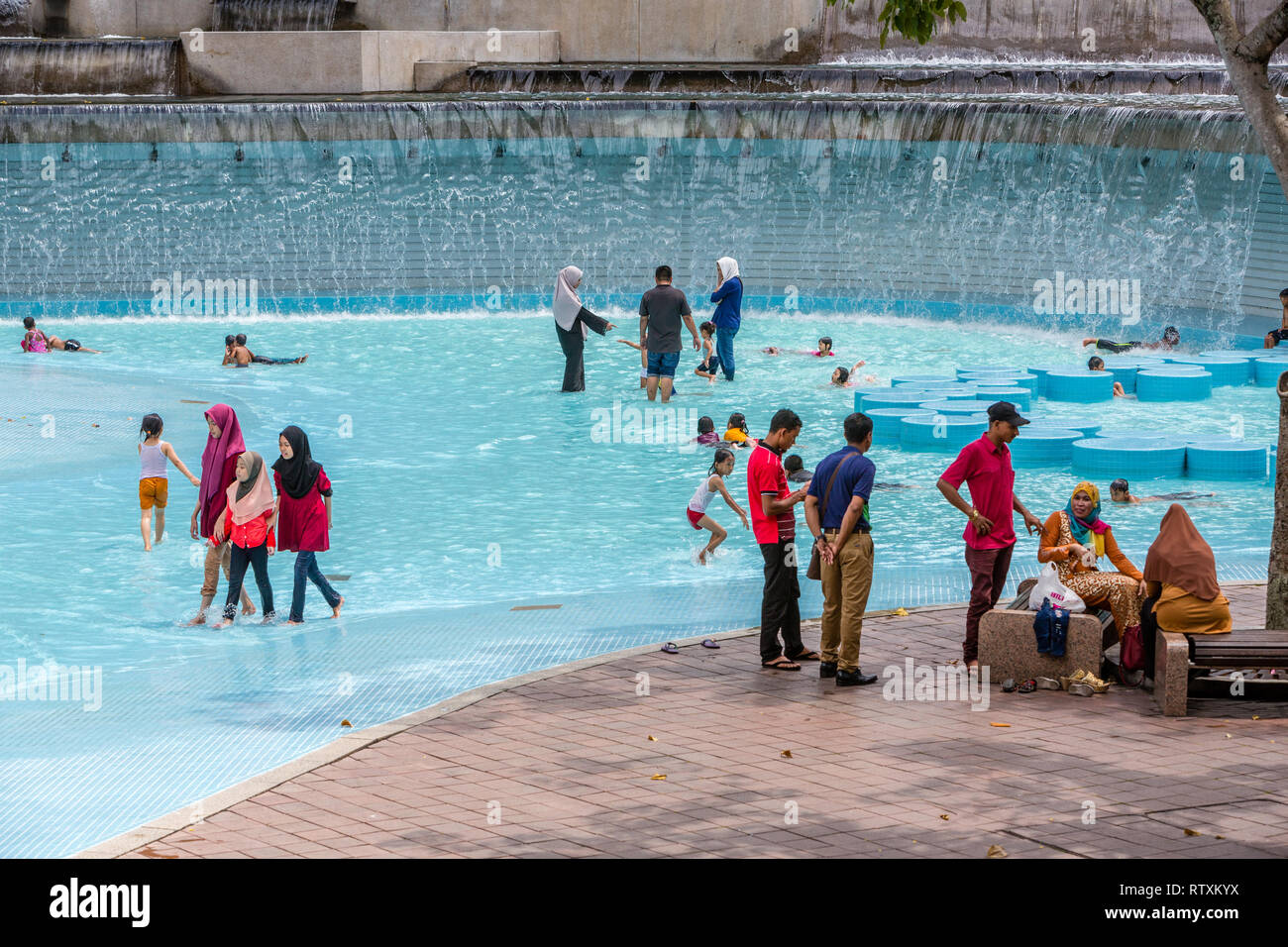 Malaysians in Swimming Pool, KLCC Park, Kuala Lumpur, Malaysia Stock ...