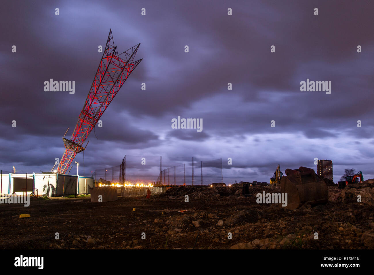 n electricity pylon appears to have dropped from the sky onto wasteland ...