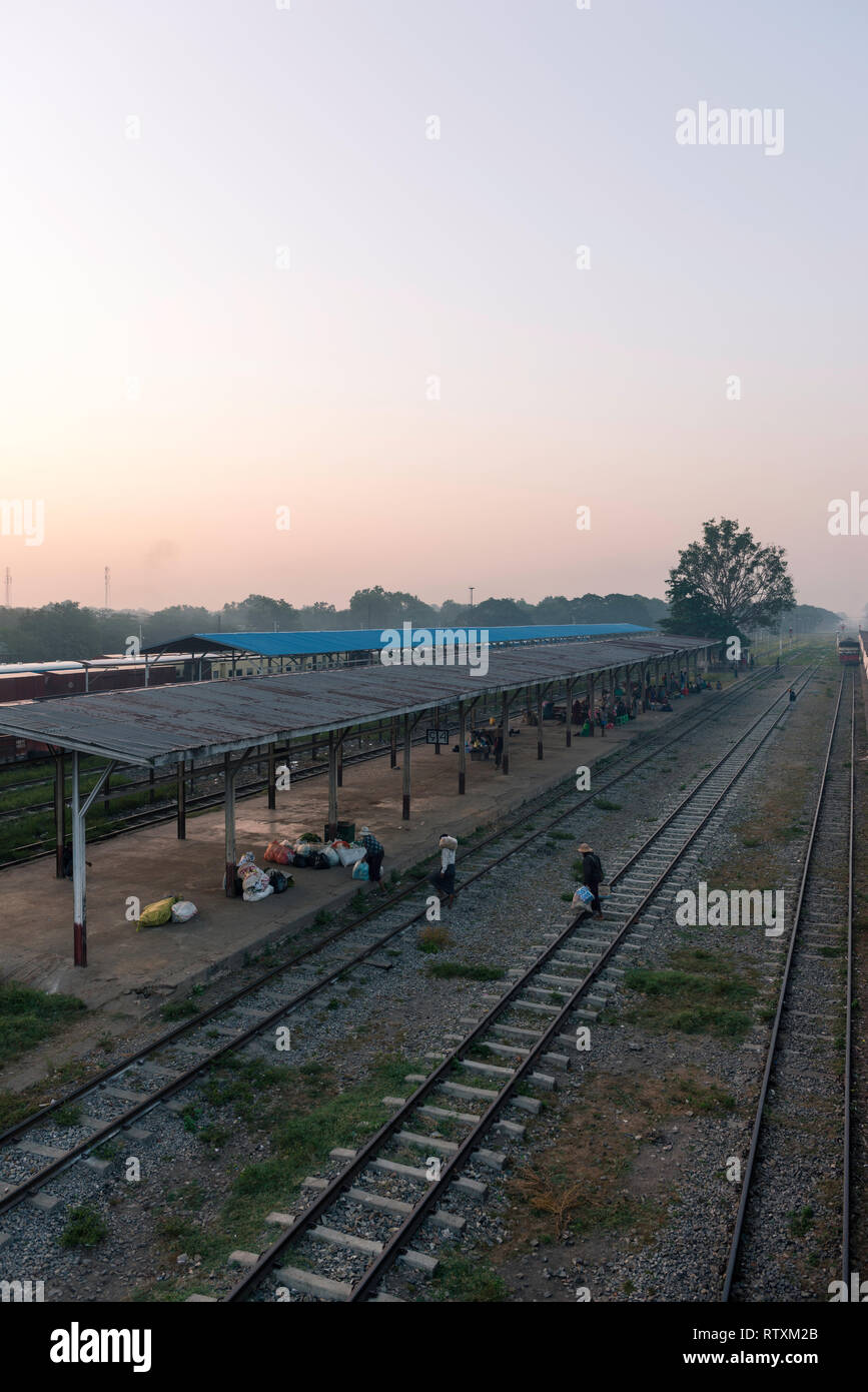 THAZI, MYANMAR - 23 NOVEMBER, 2018: Vertical picture of people walking ...
