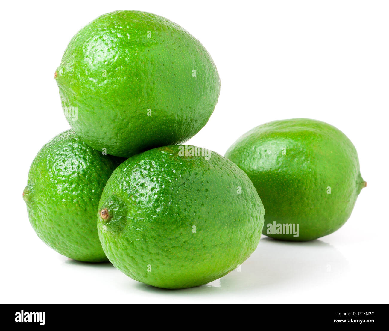four lime isolated on white background close up Stock Photo - Alamy