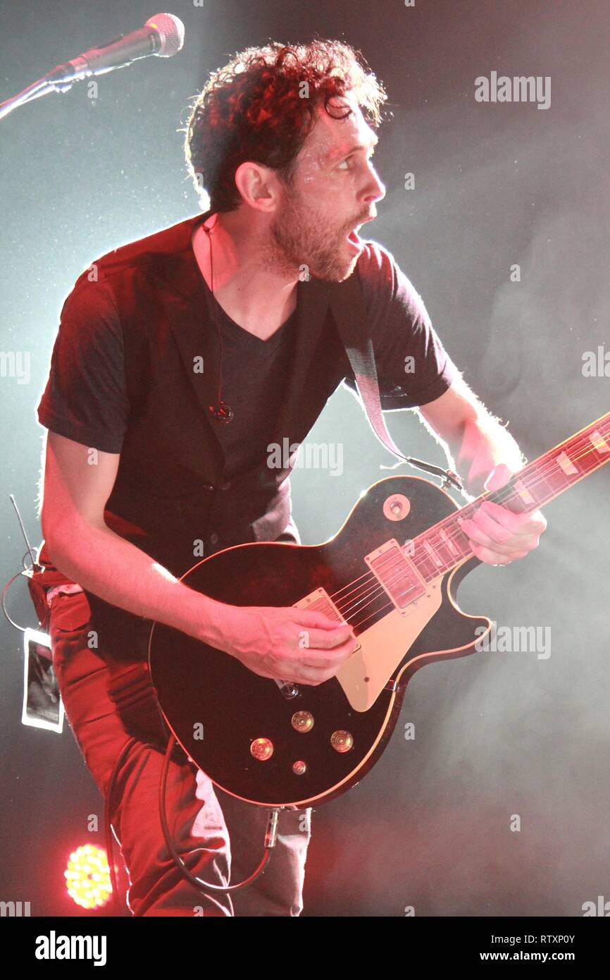 Lead guitarist and singer Kryz Reid is shown performing on stage during ...