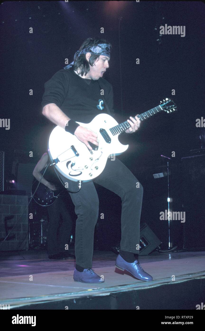 Musician George Thorogood is shown performing on stage during a "live ...