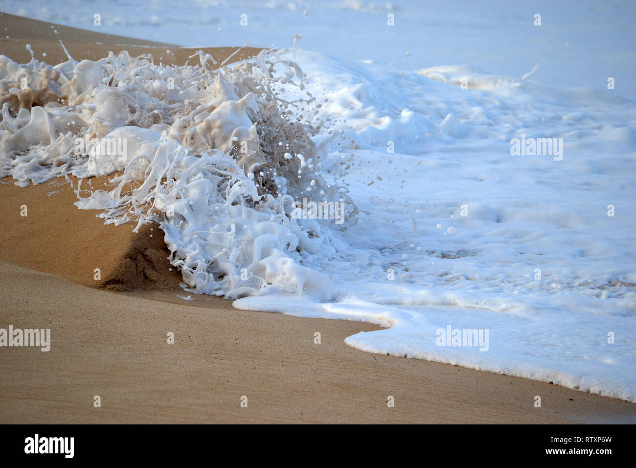 Foam from waves crashing in the shore, Waimea Bay, North Shore of Oahu ...