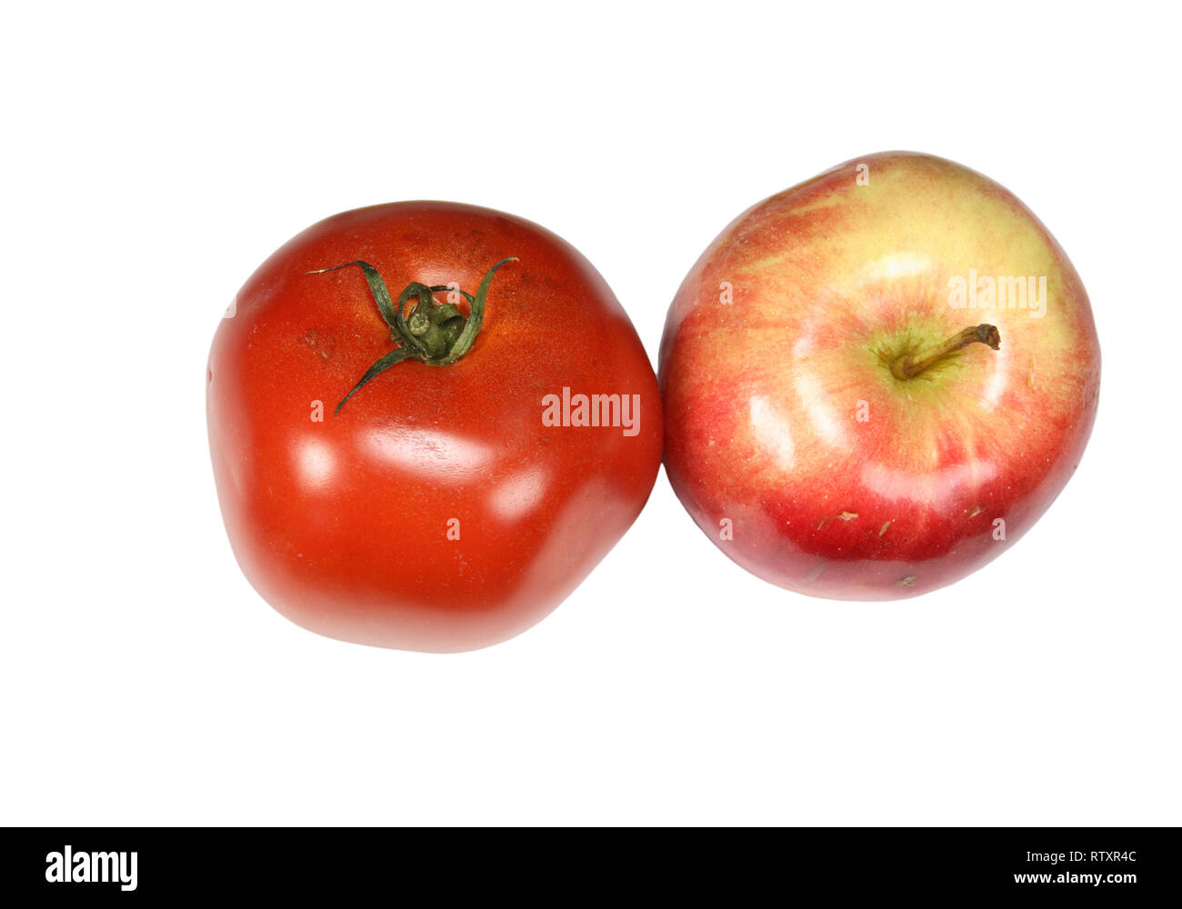 red tomato and apple on white background Stock Photo - Alamy