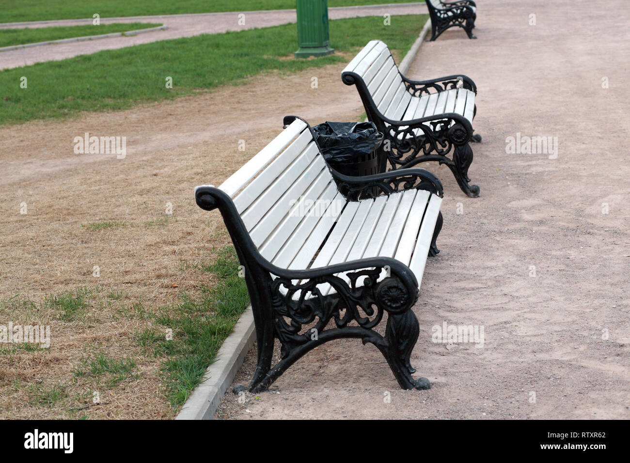 bench in city park at spring Stock Photo - Alamy
