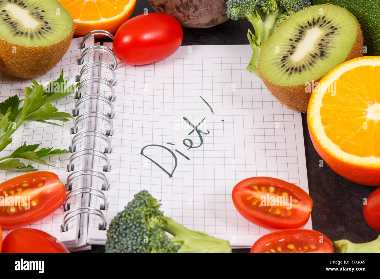 Natural fruits with vegetables as source vitamins and notepad with word ...