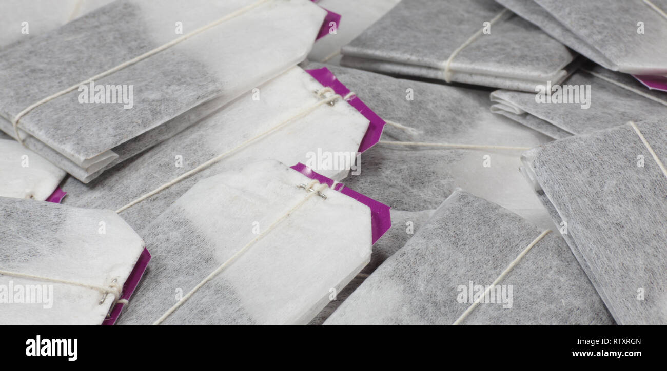 packets of black tea with red tags Stock Photo - Alamy