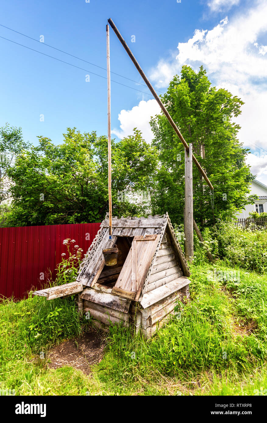 Old village wooden water well at the countryside in summer day Stock ...