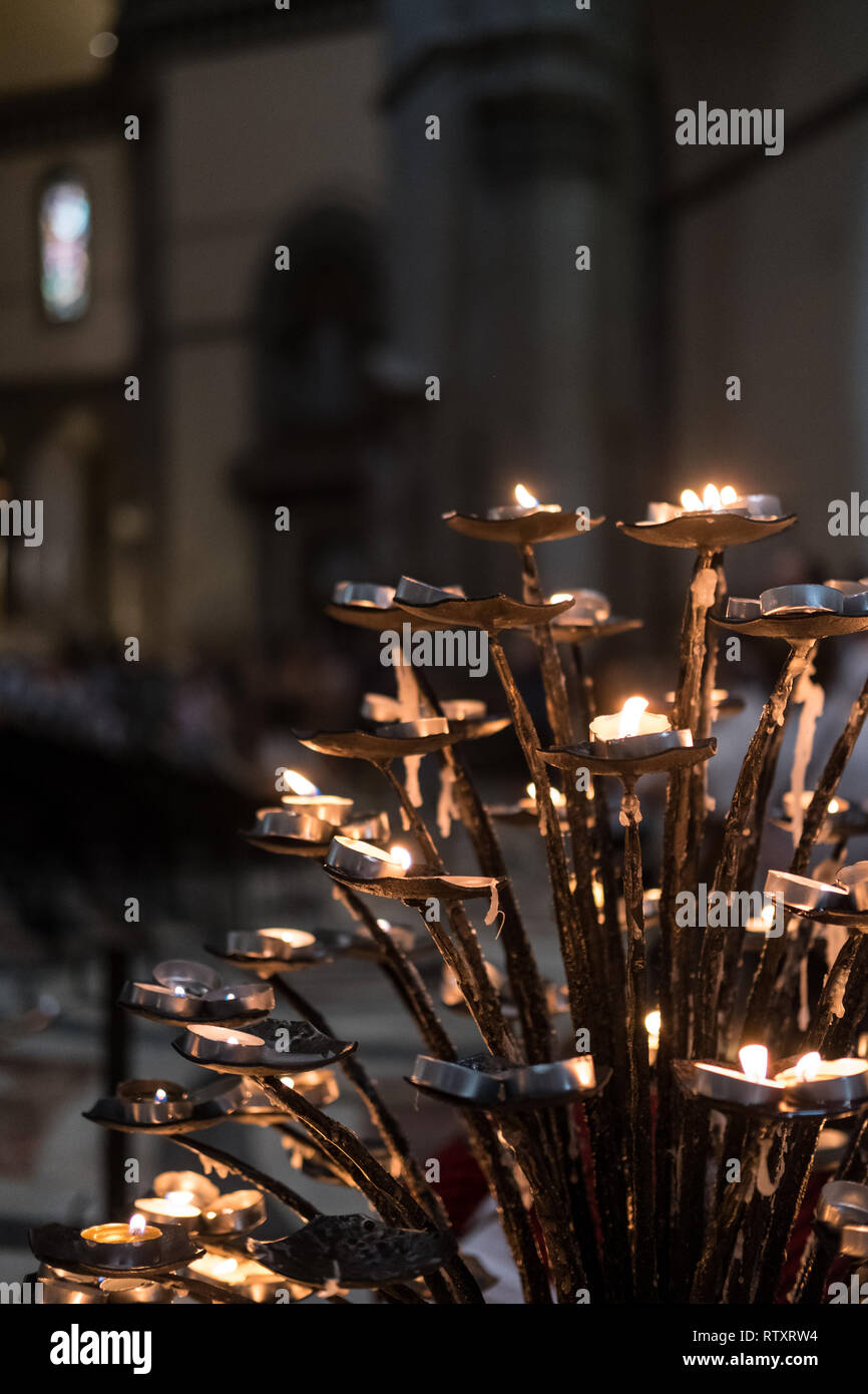 Burning Candles in the dark, in the Church Stock Photo - Alamy