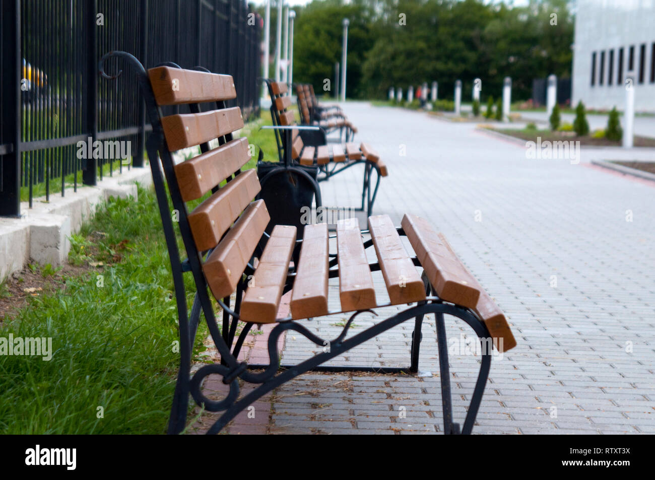 High resolution image. Bench in city street. City sidewalk Stock Photo ...