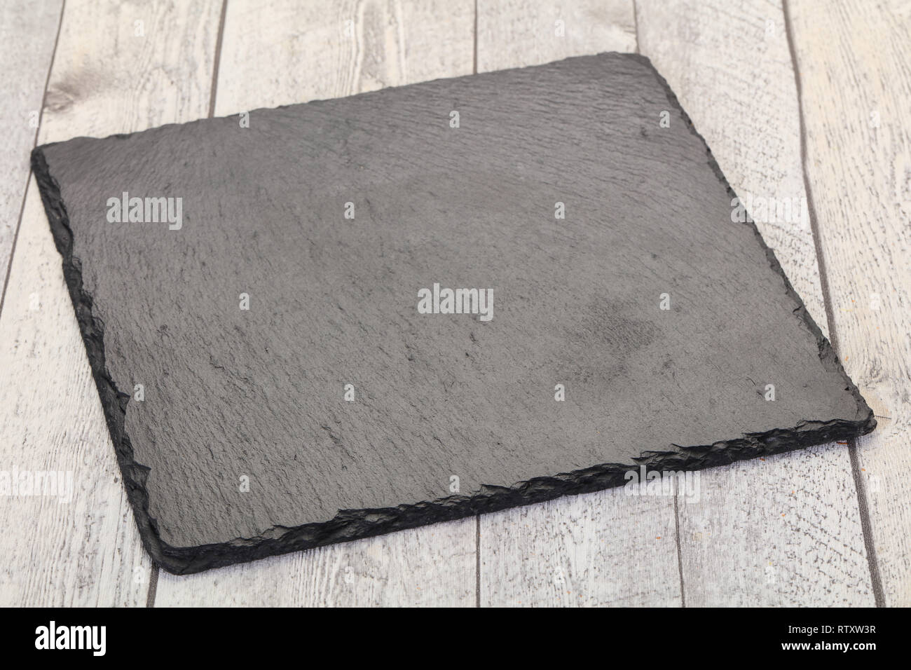 Stone board for serving dishes - kitchenware Stock Photo - Alamy