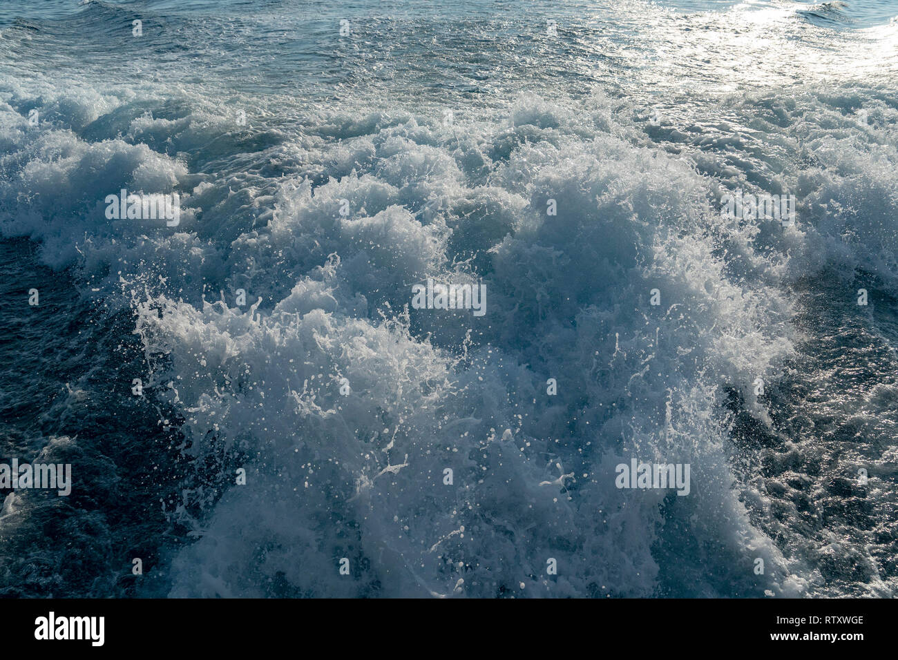 ship wake in pacific ocean at sunset Stock Photo - Alamy