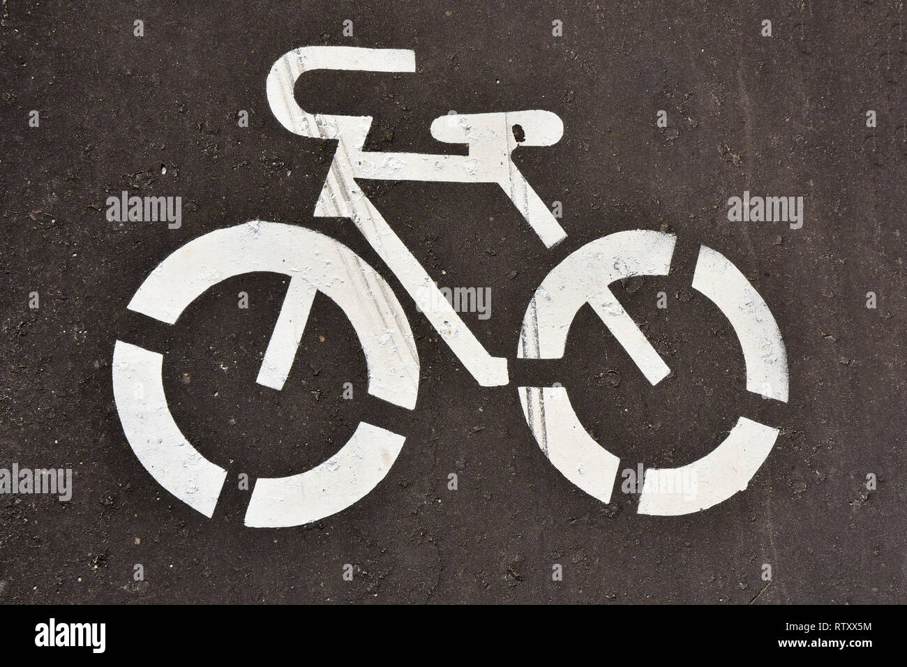 White bicycle road sign on an asphalt road Stock Photo - Alamy