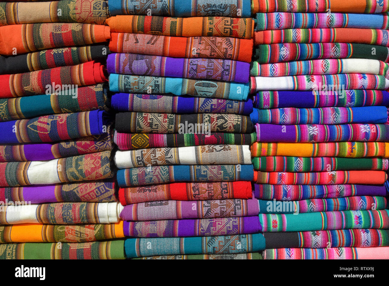 A pile of colorful rugged Peruvian textile and fabrics Stock Photo - Alamy