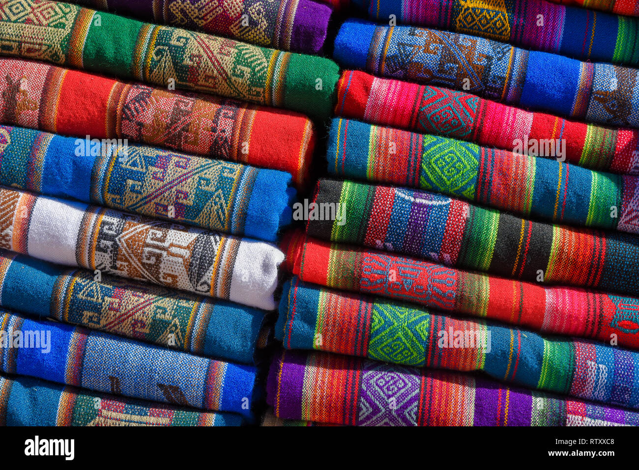 A pile of colorful rugged Peruvian textile and fabrics Stock Photo - Alamy