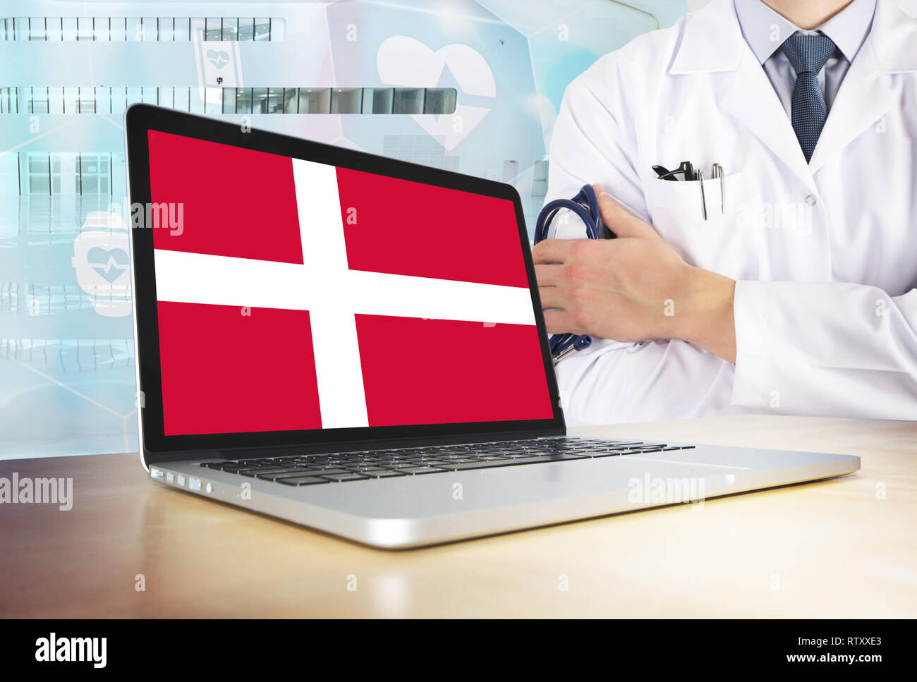 Denmark healthcare system in tech theme. Danish flag on computer screen ...