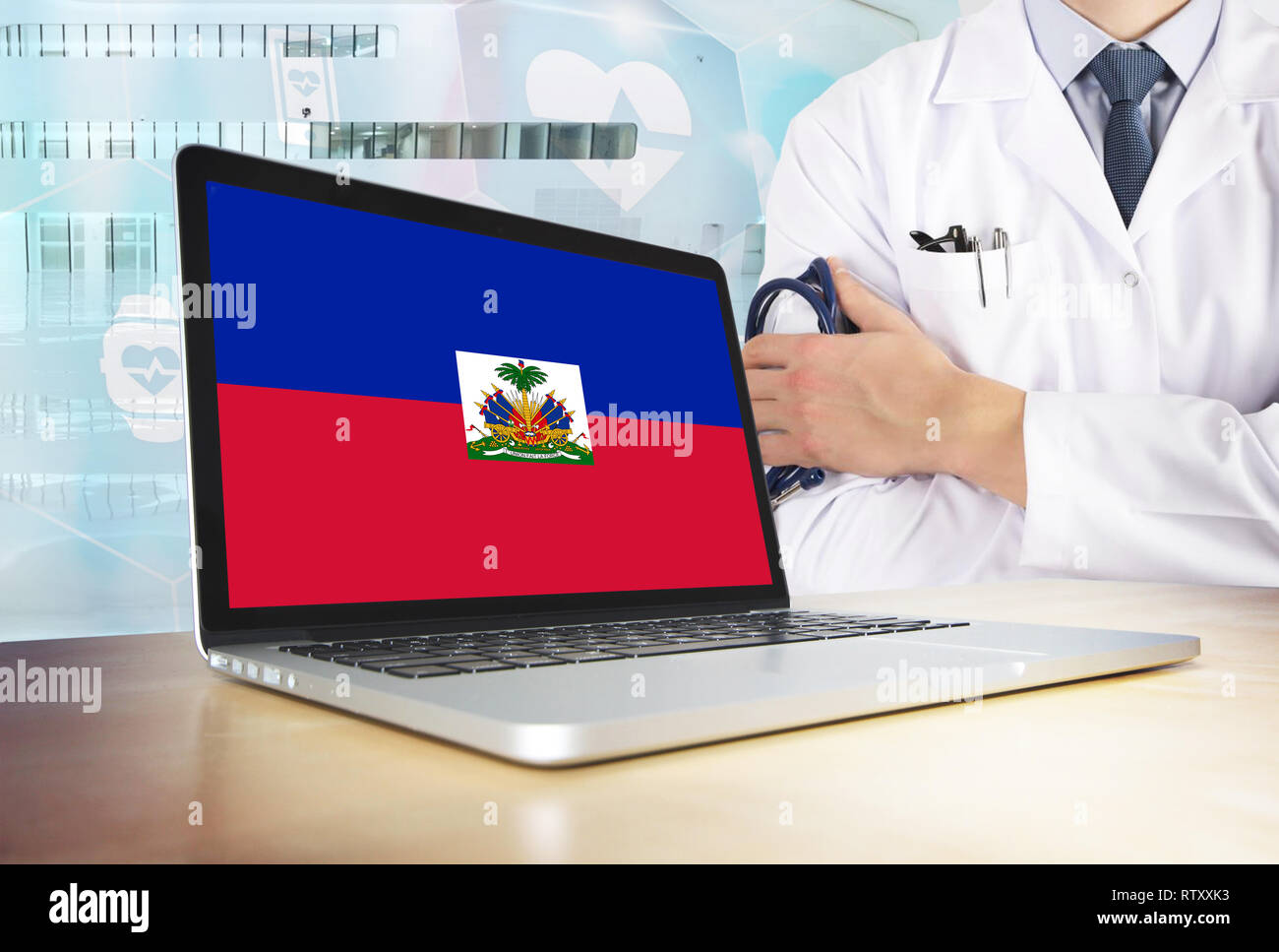 Haiti healthcare system in tech theme. Haitian flag on computer screen ...