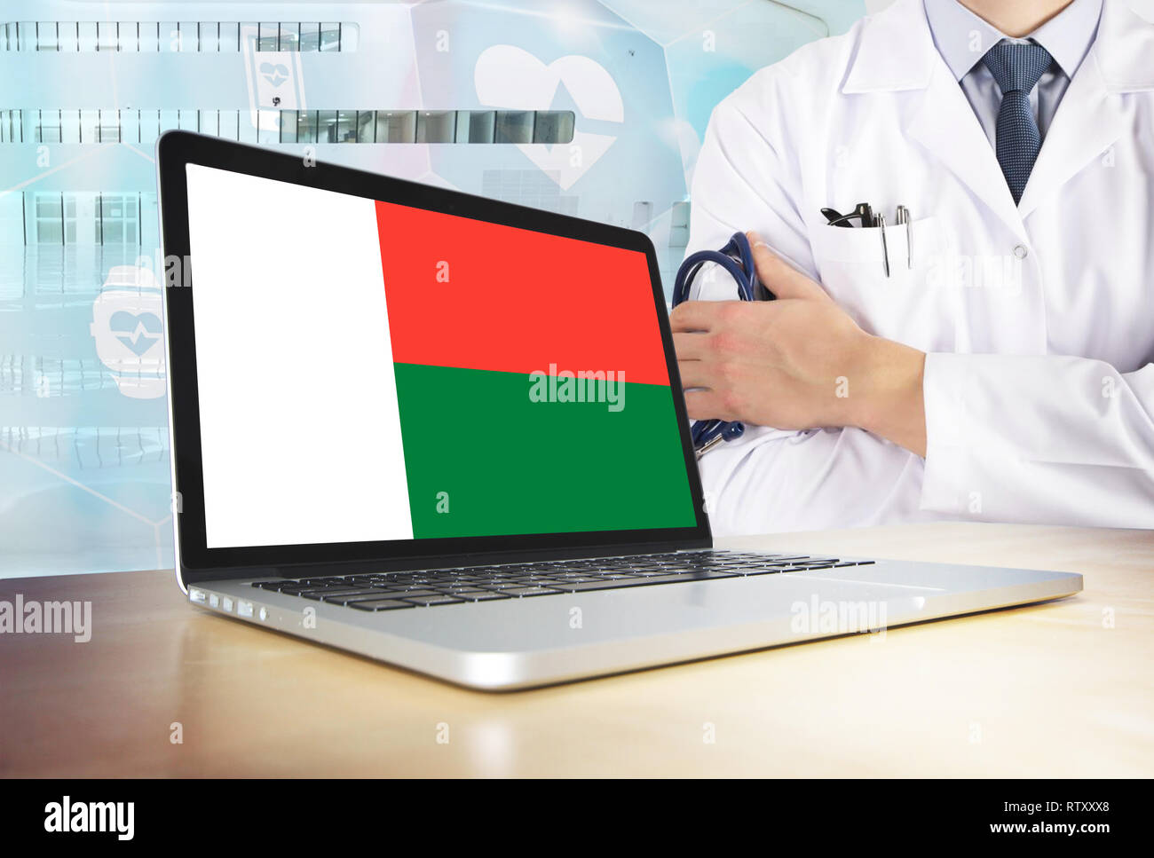 Madagascar healthcare system in tech theme. Malagasy flag on computer ...