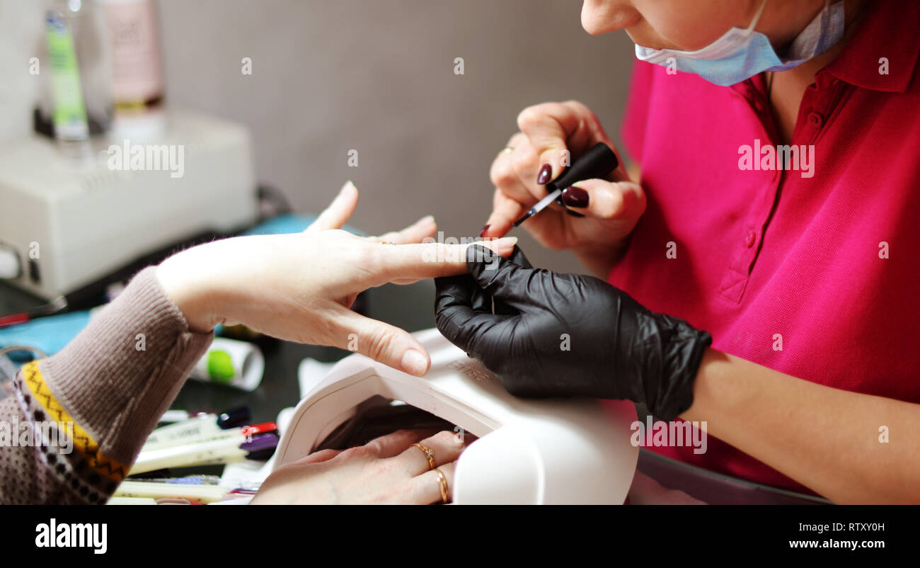 Coating gel varnish photography close-up.manicure in the salon Stock ...