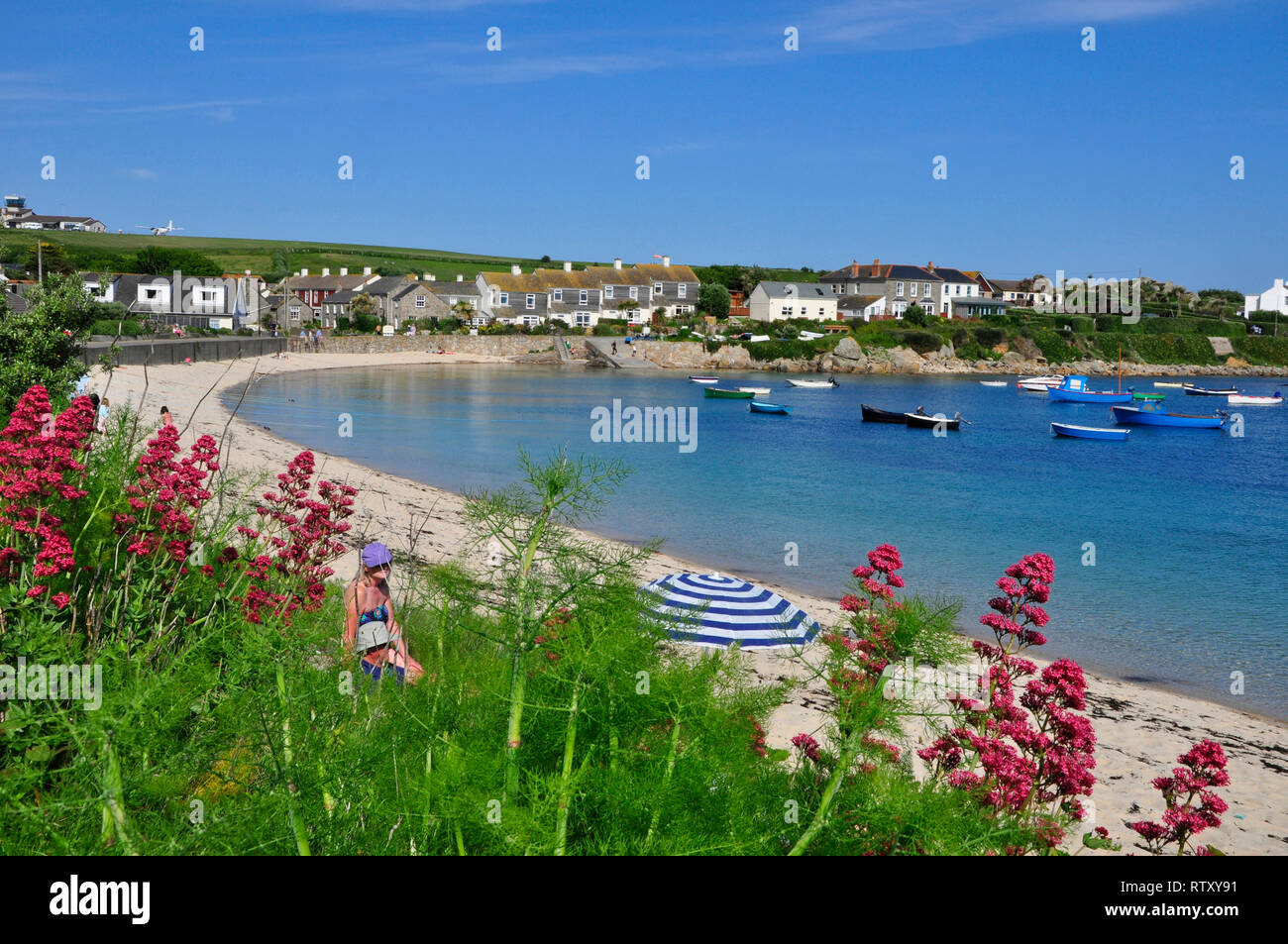 Old Town beach on St Marys, Isles of Scilly with the tide in on a sunny ...