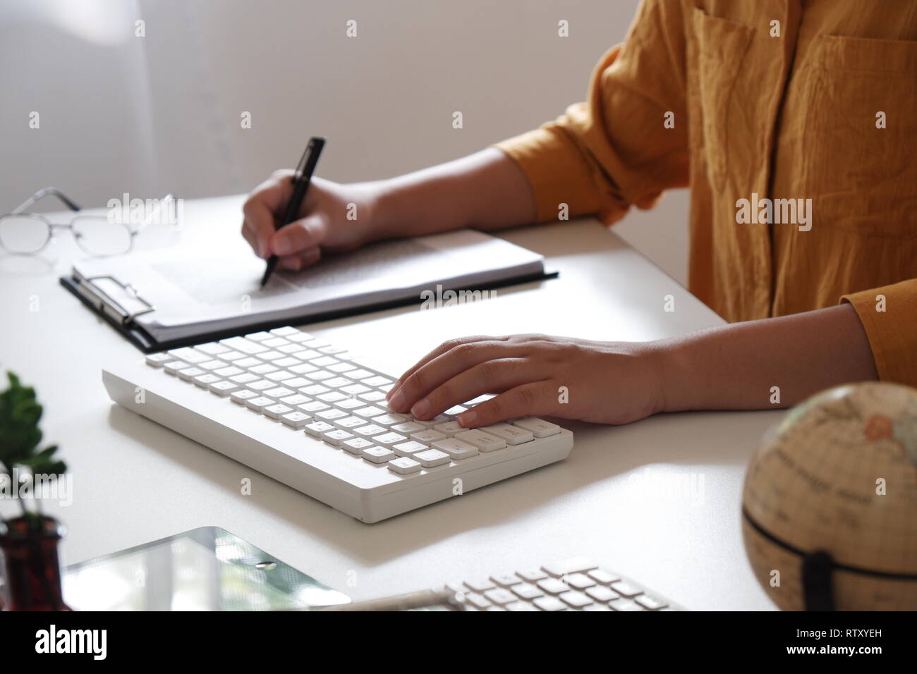 Young businesswoman writing something hi-res stock photography and ...