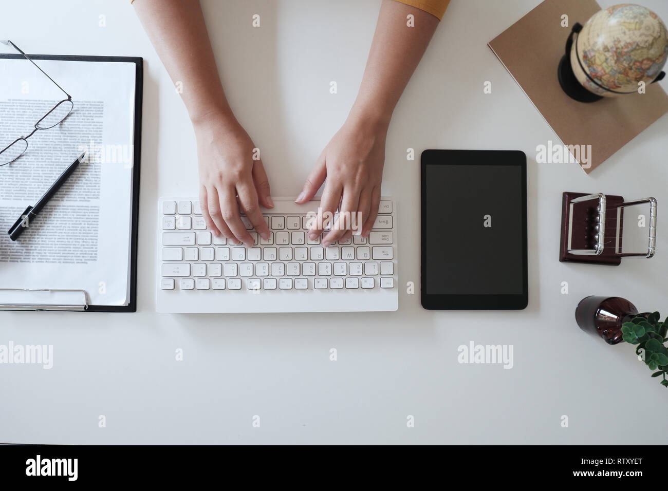 close up women hand while typing on keyboard in office Stock Photo - Alamy
