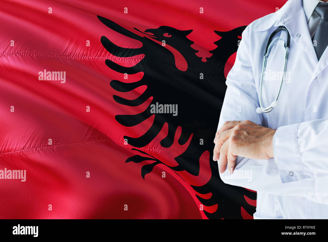 Albanian Doctor standing with stethoscope on Albania flag background ...