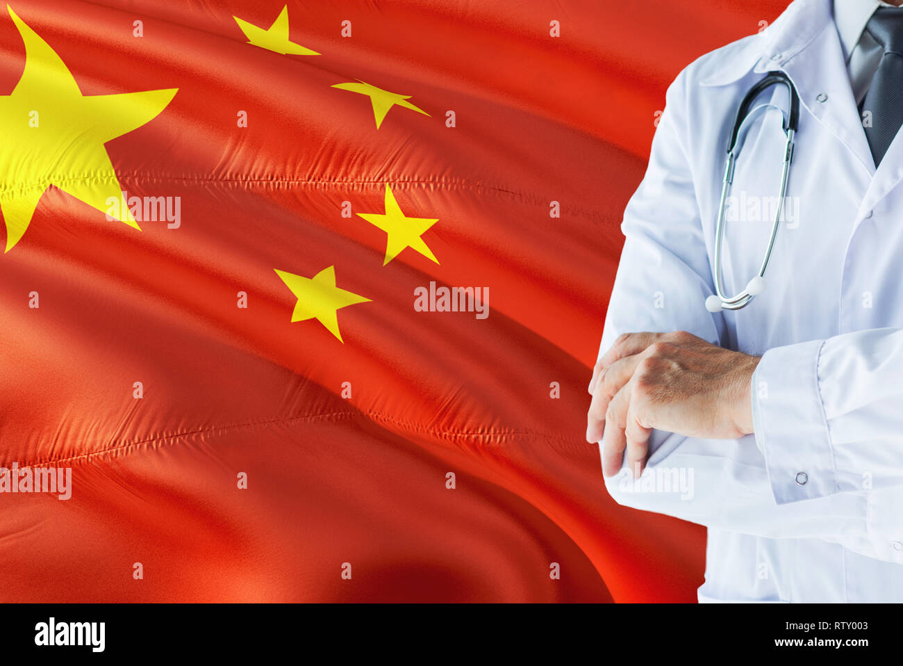 Chinese Doctor standing with stethoscope on China flag background ...