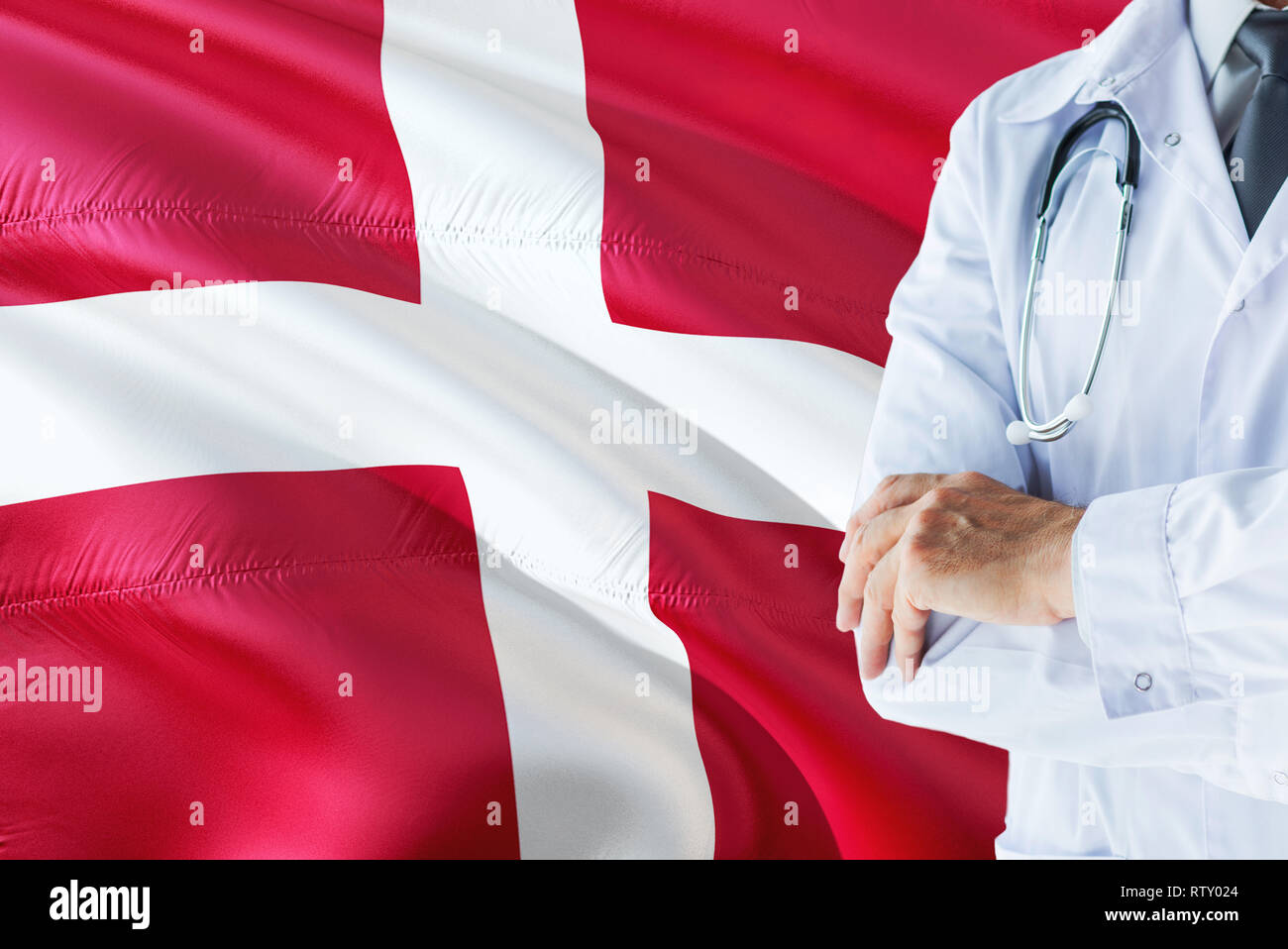 Danish Doctor standing with stethoscope on Denmark flag background ...