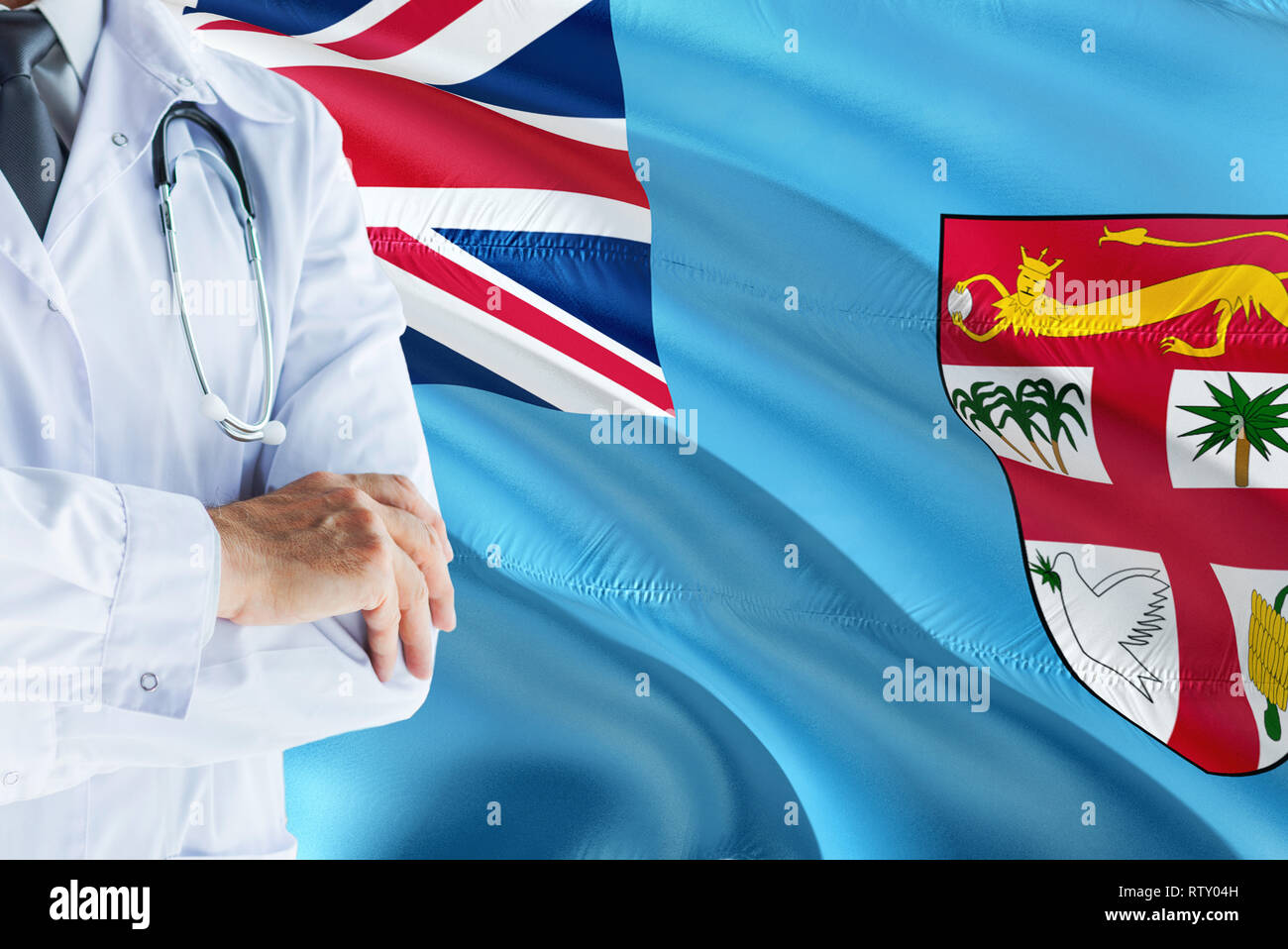 Fijian Doctor standing with stethoscope on Fiji flag background ...