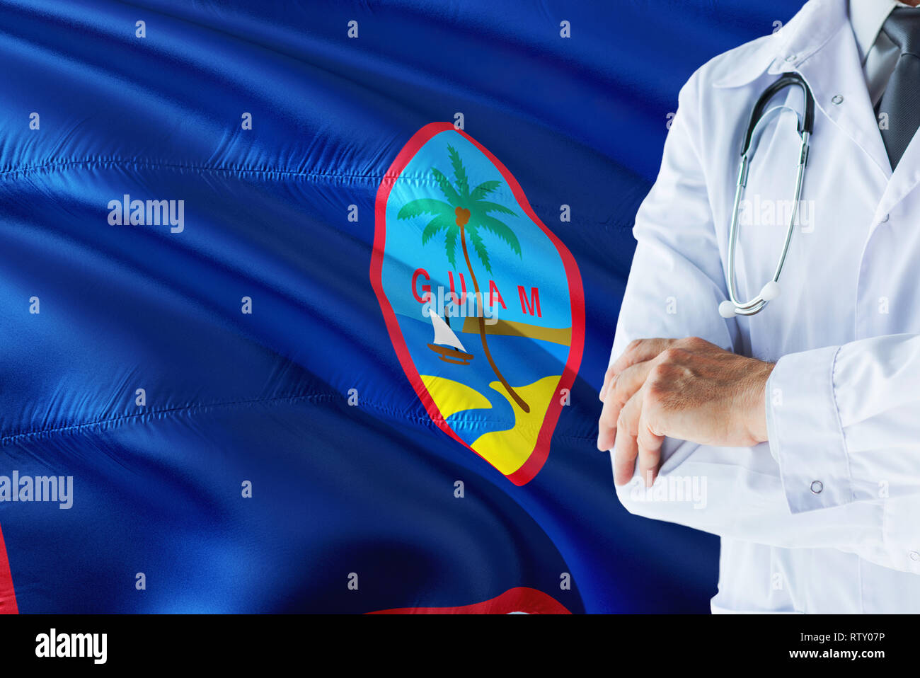 Doctor standing with stethoscope on Guam flag background. National ...