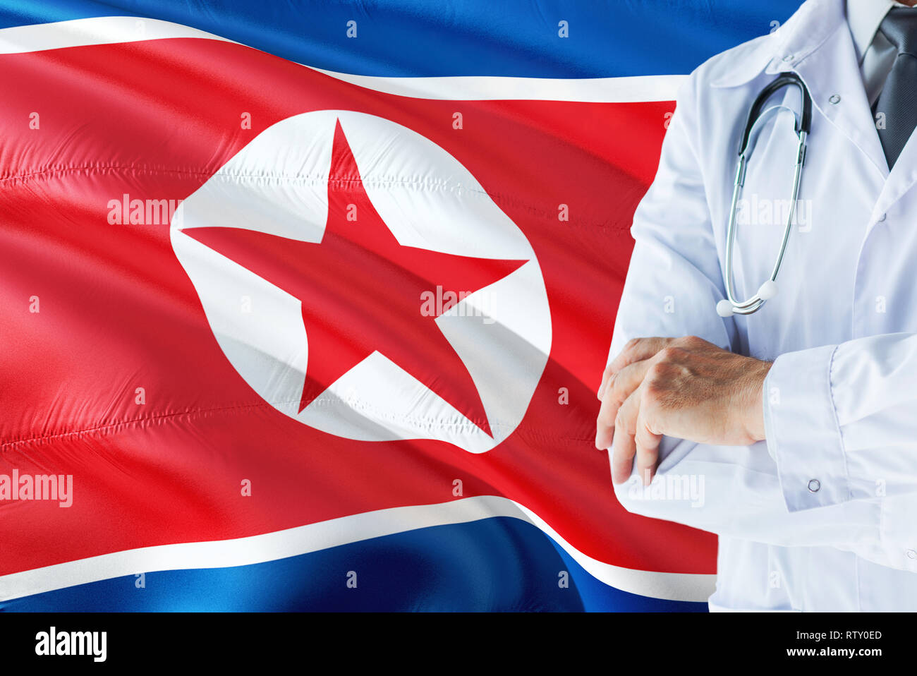 North Korean Doctor standing with stethoscope on North Korea flag ...