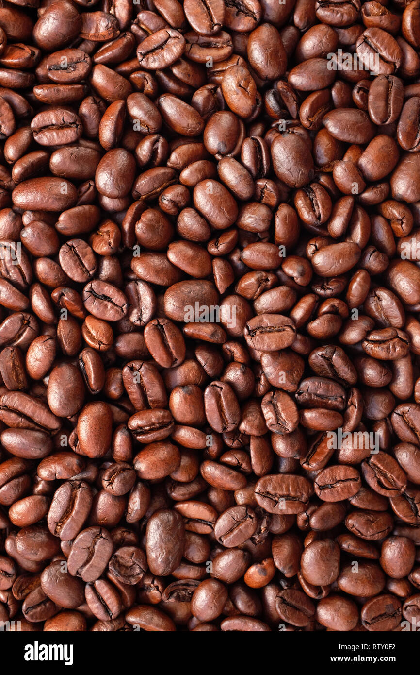 Dark roasted coffee beans as an abstract background texture Stock Photo ...