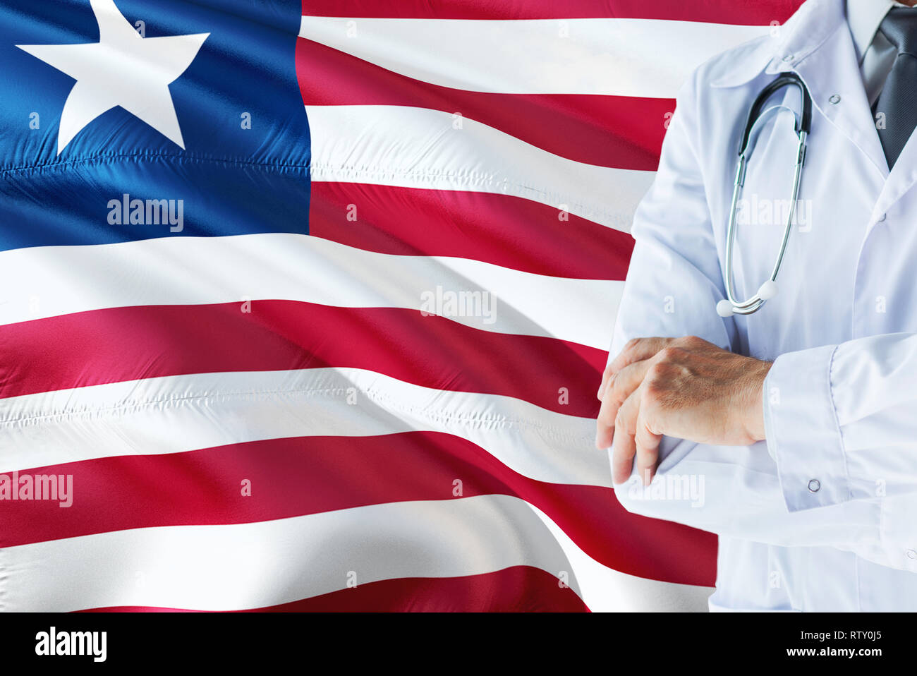 Liberian Doctor standing with stethoscope on Liberia flag background ...