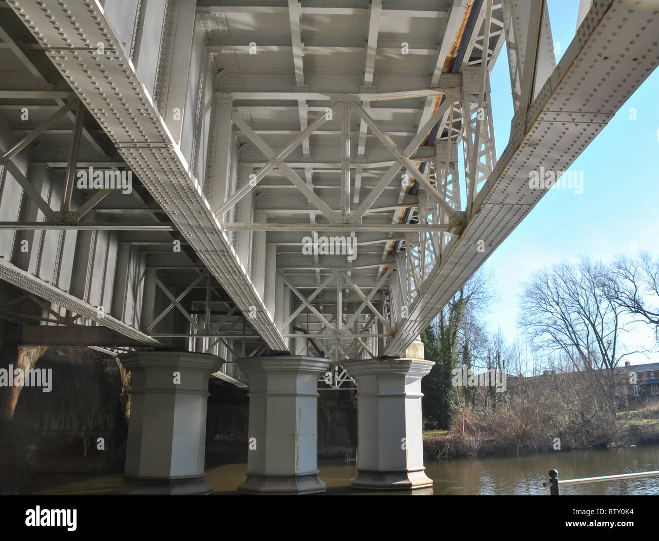 The underside of a railway bridge showing steel support lattice of ...