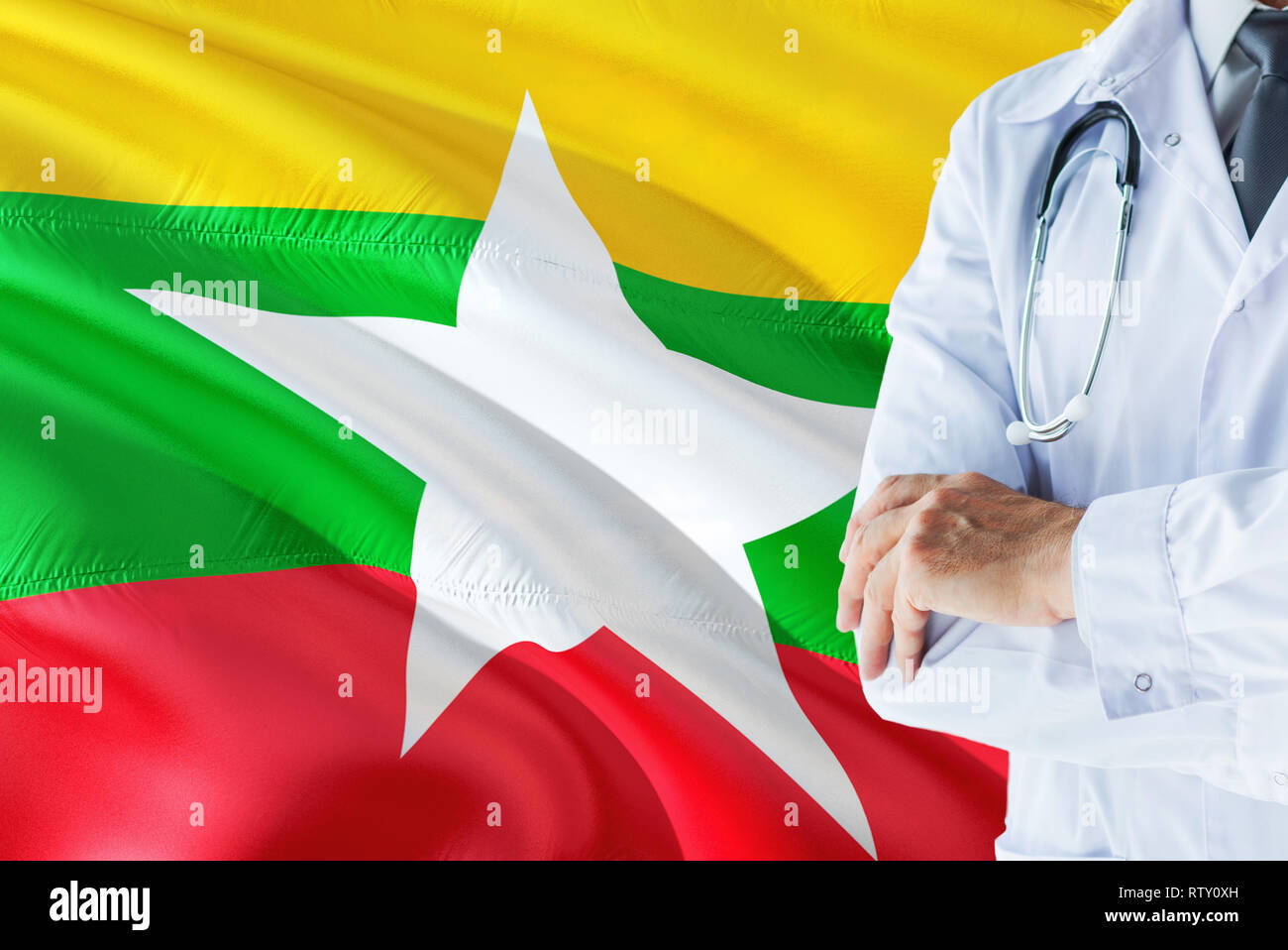 Burmese Doctor standing with stethoscope on Myanmar flag background ...