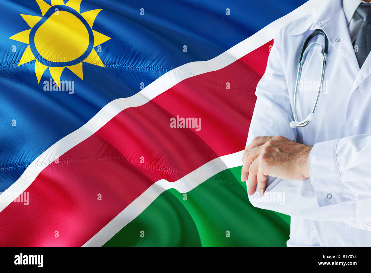 Namibian Doctor standing with stethoscope on Namibia flag background ...