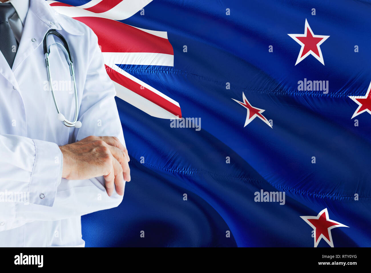 Kiwi Doctor standing with stethoscope on New Zealand flag background ...