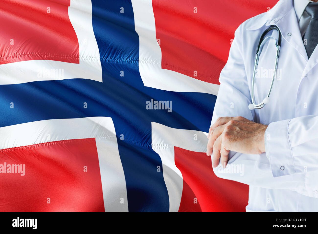 Norwegian Doctor standing with stethoscope on Norway flag background ...