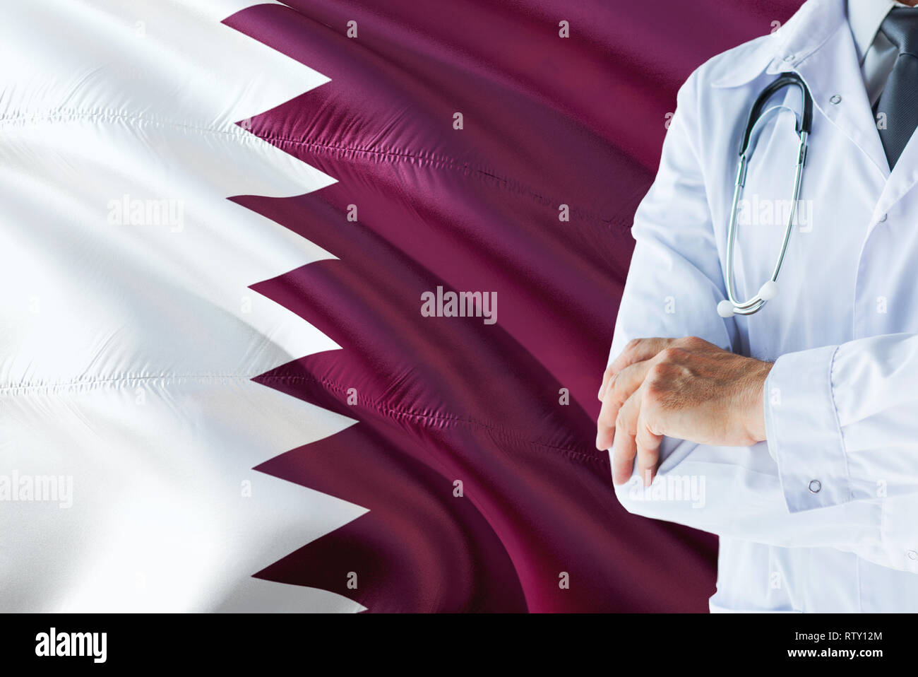 Qatari Doctor standing with stethoscope on Qatar flag background ...