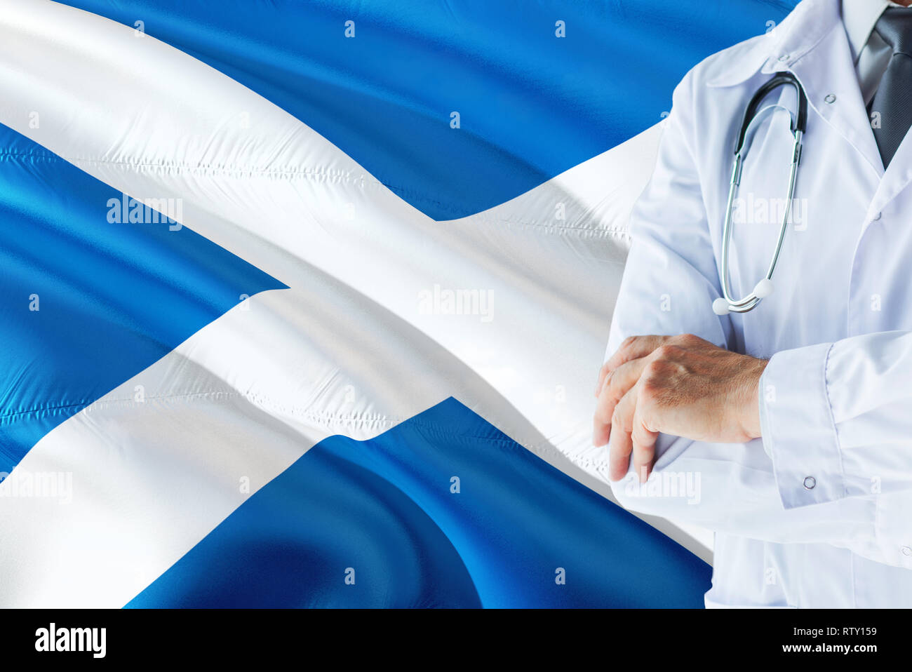 Scottish Doctor standing with stethoscope on Scotland flag background ...