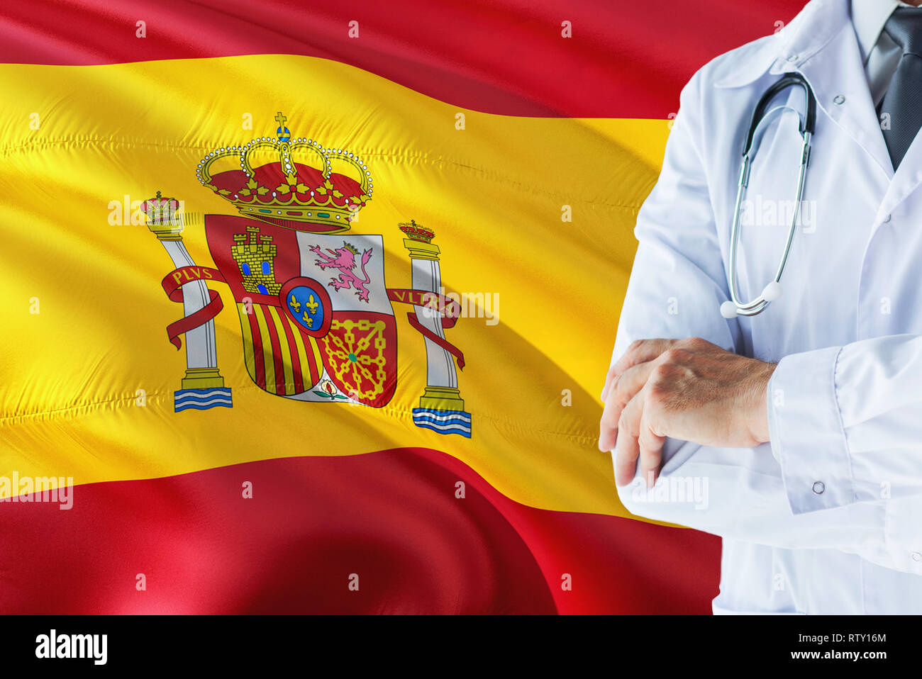 Spanish Doctor standing with stethoscope on Spain flag background ...