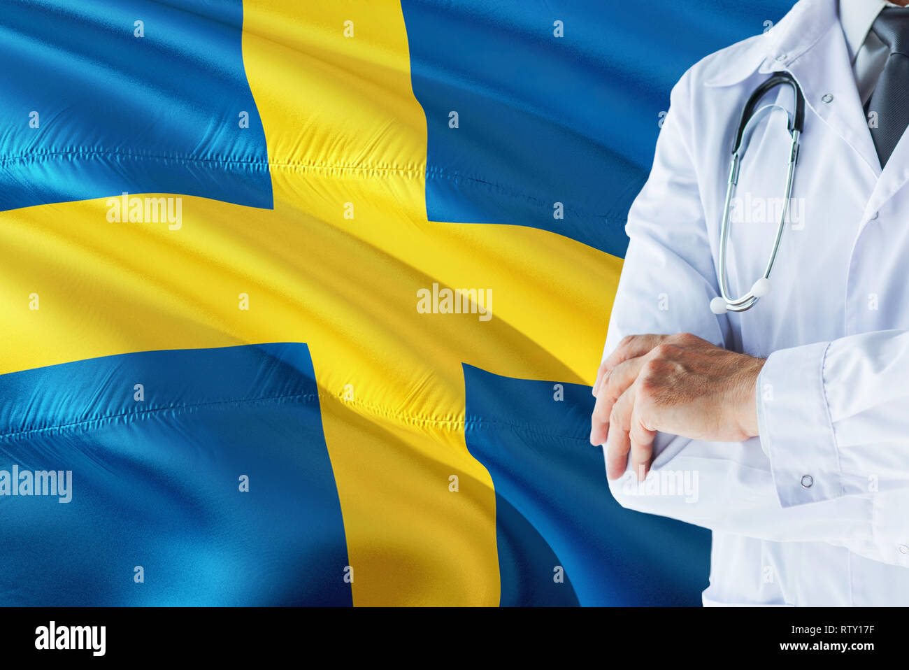 Swedish Doctor standing with stethoscope on Swaziland flag background ...