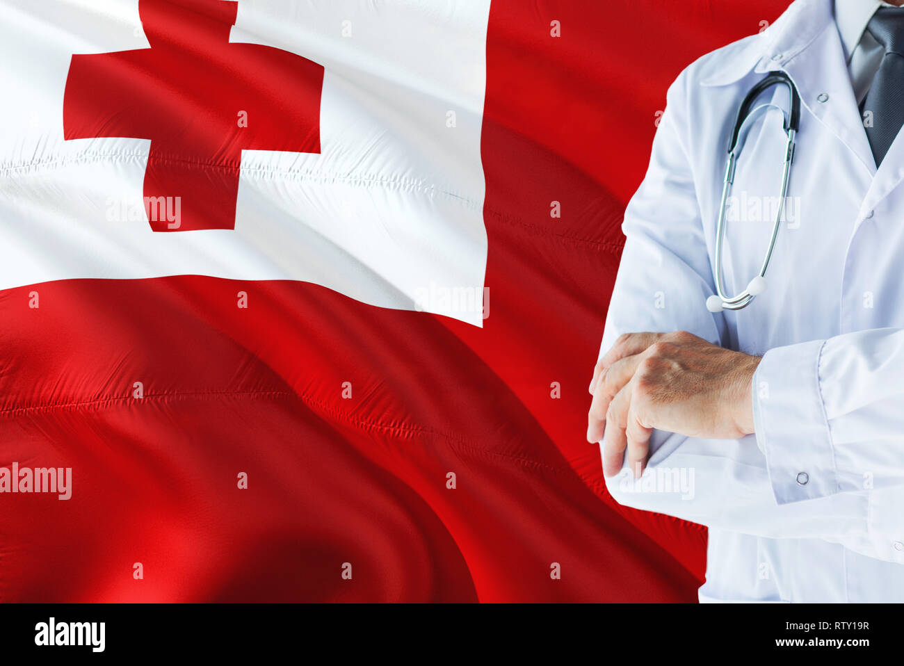 Tongan Doctor standing with stethoscope on Tonga flag background ...