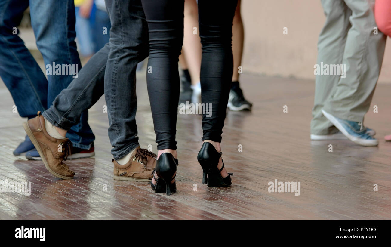 Young people dancing on stage. Legs of young people dancing at party ...