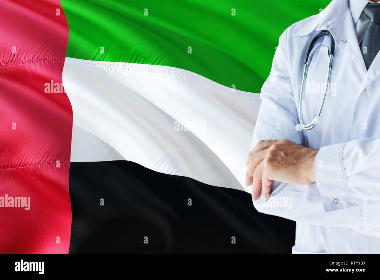 Emirian Doctor standing with stethoscope on United Arab Emirates flag ...