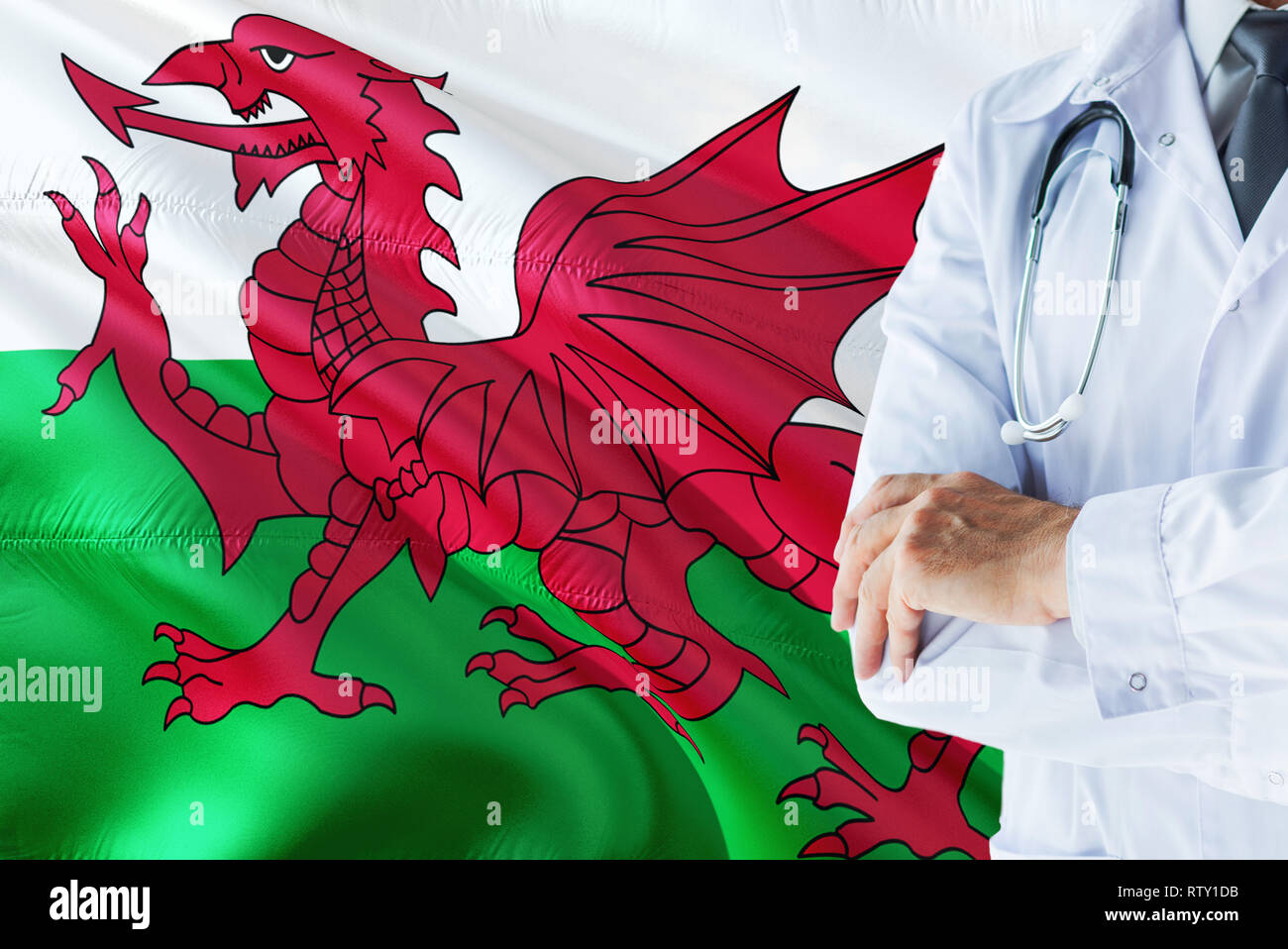 Welsh Doctor standing with stethoscope on Wales flag background ...