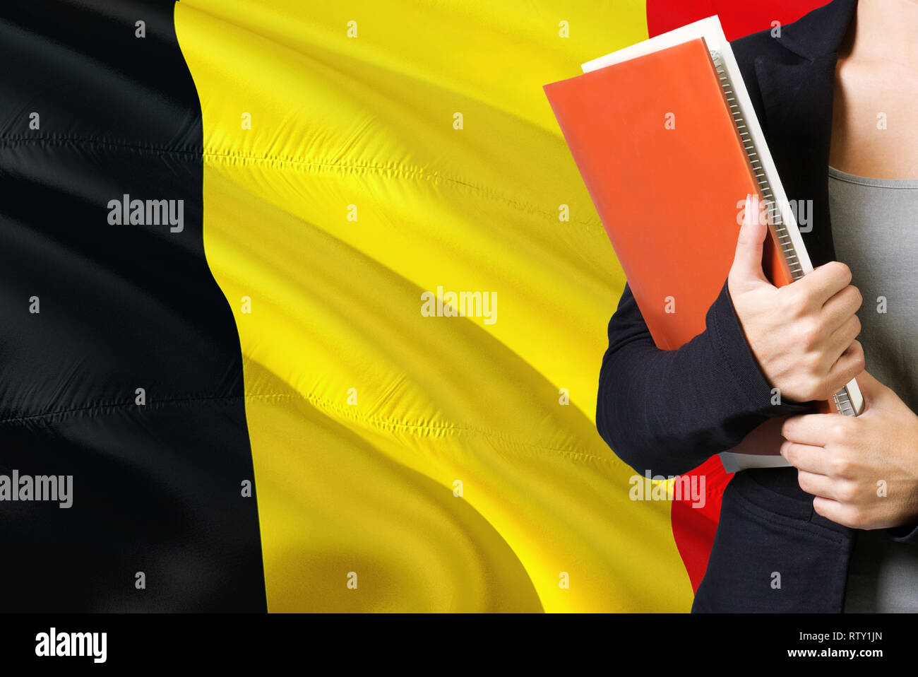 Learning Belgian language concept. Young woman standing with the ...