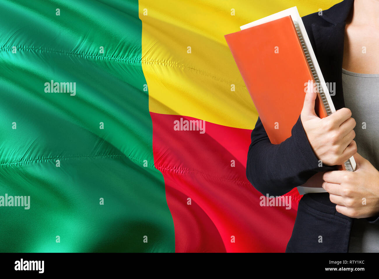 Learning Beninese language concept. Young woman standing with the Benin ...
