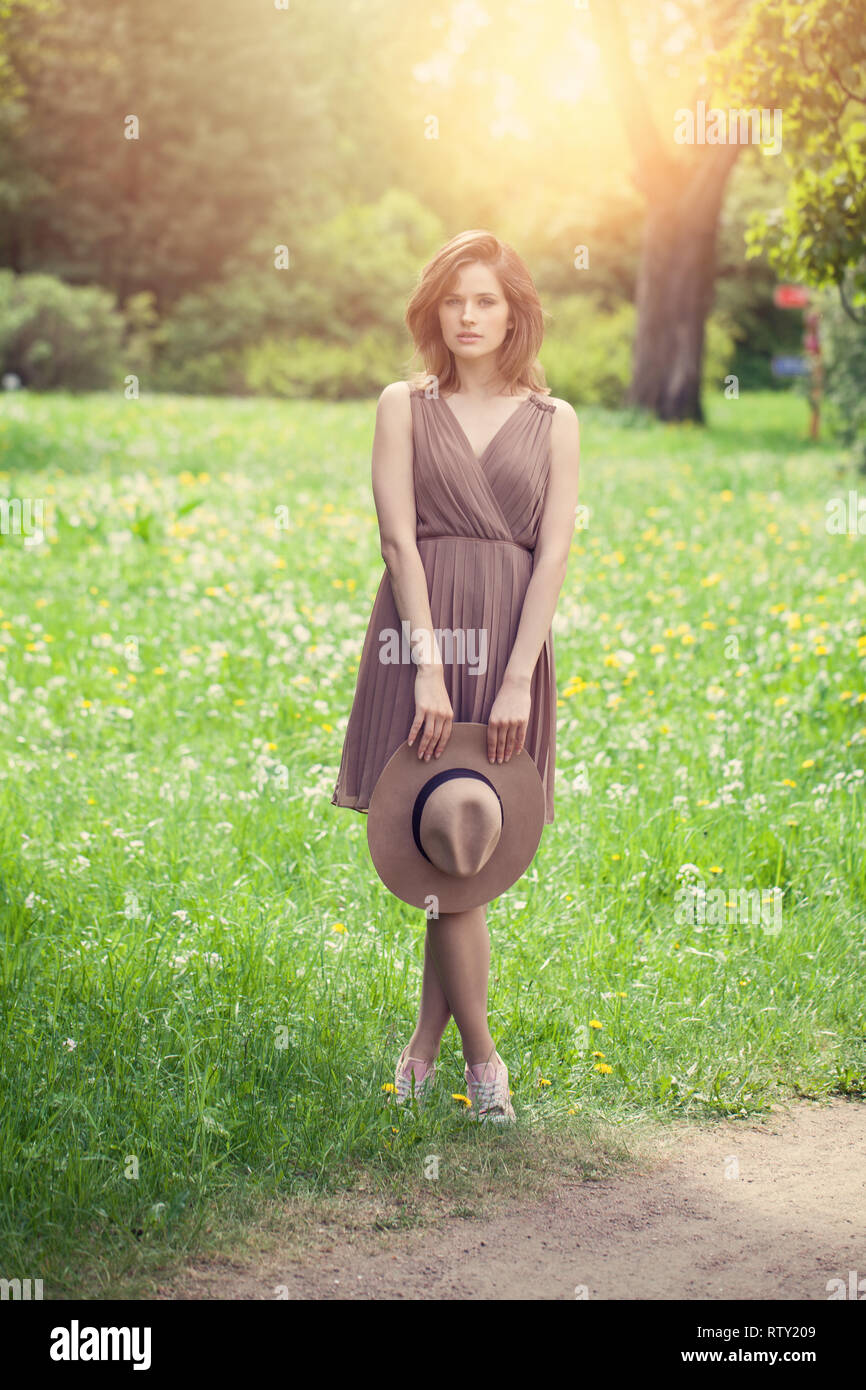 Spring woman walking in park outdoor Stock Photo - Alamy
